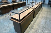 China Modular Dark Wood Grain Jewelry Showcase Counter with Curved Cabinet and Bottom Ambient Light for sale