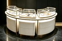 China Combined Curved Jewelry Island Showcase with Champagne Gold Frame and Modular Structure for sale