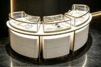 China Combined Curved Jewelry Island Showcase with Champagne Gold Frame and Modular Structure for sale