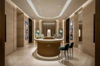 China Modern-Luxury Minimalist Watch Showcase Display with Circular Wood Island and VIP Lounge & Bar Area for sale