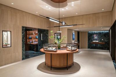 China Modern-Luxury Minimalist Watch Showcase Display with Circular Wood Island and VIP Lounge & Bar Area for sale