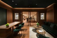 China Modern-Luxury Minimalist Watch Showcase Display with Circular Wood Island and VIP Lounge & Bar Area for sale