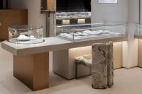 China Modern-Oriental Minimalist Jewelry Showroom with Stone-Veneer Display Cases and Freestanding Pillar Vitrines for sale