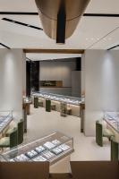 China Modern-Oriental Minimalist Jewelry Showroom with Stone-Veneer Display Cases and Freestanding Pillar Vitrines for sale