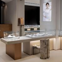 China Modern-Oriental Minimalist Jewelry Showroom with Stone-Veneer Display Cases and Freestanding Pillar Vitrines for sale