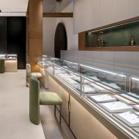 China Modern-Oriental Minimalist Jewelry Showroom with Stone-Veneer Display Cases and Freestanding Pillar Vitrines for sale