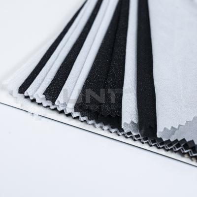China 100% Polyester 22 gsm 122cm Width Woven Interlining Fusible Interlining for Women's Wear for sale