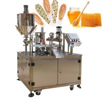 China Honey Spoon Filling Sealing Machine 220V 800-1000 Cups per Hour Automatic Piston Filler for sale