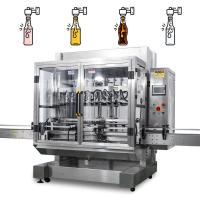 China Automatic Inline Gravity Filling Machine with Time-controlled Gravity Volumetric Filling, Food-grade 304 Stainless Steel, and ≤±0.2% FS Filling Accuracy for sale