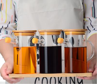 China Leak Proof ISO Clear Glass Canisters Sauce Bottle With Bamboo Lid for sale