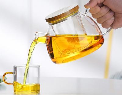 China 550ml 800ml High Borosilicate Glass Tea Kettle Pot With Glass  Infuser Bamboo Lid for sale