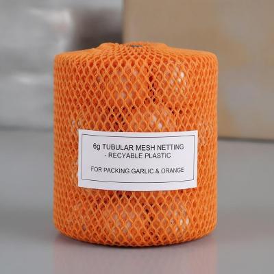 China 6g Tubular Mesh Netting Recyclable Plastic Tubular Net For Packing Garlic Orange for sale