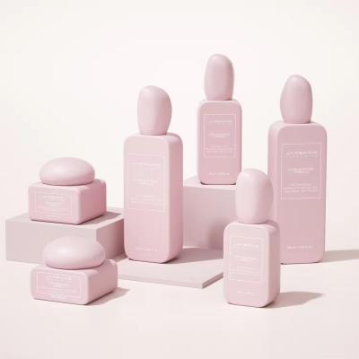 China Custom Pink Cosmetic Bottles and Jars 50ML Capacity Luxury Lotion Pump Packaging for Skincare Products for sale