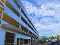 China 16,800㎡ steel structure building with partial four floors, adopting polyurethane sandwich wall panels for superior insulation performance. for sale