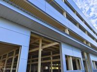 China 16,800㎡ steel structure building with partial four floors, adopting polyurethane sandwich wall panels for superior insulation performance. for sale