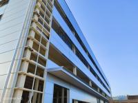 China 16,800㎡ steel structure building with partial four floors, adopting polyurethane sandwich wall panels for superior insulation performance. for sale