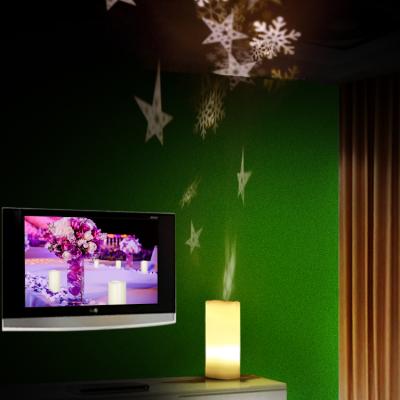 China Christmast Decoration Lamp Simulation LED Projection Candle Light Battery Operated Rotating Luminous Atmosphere Christmas Gift With Remote Control for sale