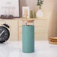 China Nontoxic Silicone Water Bottle Transparent Glass With Silicone Straw Bamboo Lids for sale