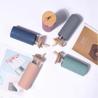China Nontoxic Silicone Water Bottle Transparent Glass With Silicone Straw Bamboo Lids for sale