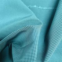 China 100D 140gsm Cationic Small Grid Four-Sided Elastic Fabric for Beach Pants and Windbreakers for sale