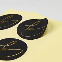 China Black Round Matte Black Paper Sticker Labels With Gold Logo for sale