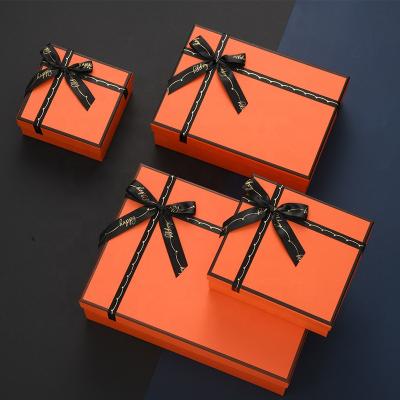 China Luxury Gift Box Orange Cosmetic Cardboard Paper Gift Box Perfume Packaging for sale