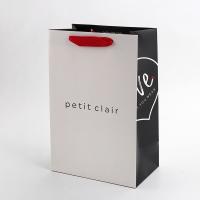China Paper Bag With Your Own Logo Shopping Packaging Bag With Ribbon Handle for sale