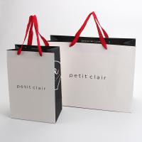 China Paper Bag With Your Own Logo Shopping Packaging Bag With Ribbon Handle for sale
