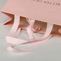 China 200gsm Paper Custom Made Shopping Bags Pink Paper Retail Bags With Ribbon Handle Logo for sale
