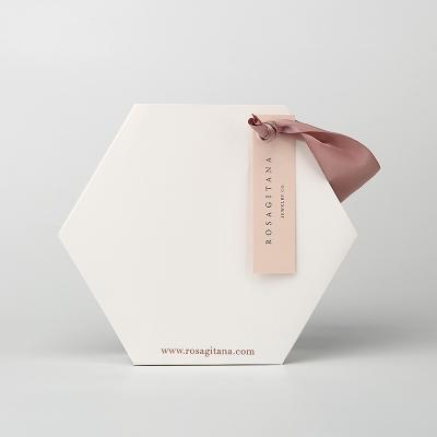China Special Design Hexagon Jewelry Paper Bag Custom Paper Shopping Bags With Ribbon for sale