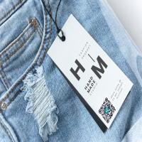 China 960Mhz Garments Price RFID Tag Sticker Swing Fabric Care Tags for sale