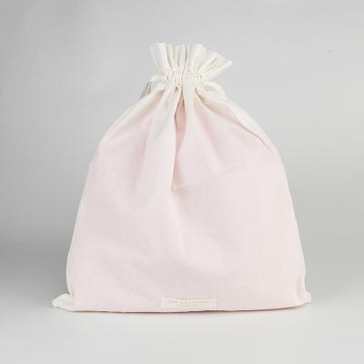 China Custom Design Drawstring Cosmetic Packaging Bag pouch With Fabric Label for sale