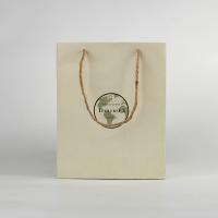 China Custom Eco Packaging Solutions Skincare Beauty Paper Shopping Bag With Handle for sale