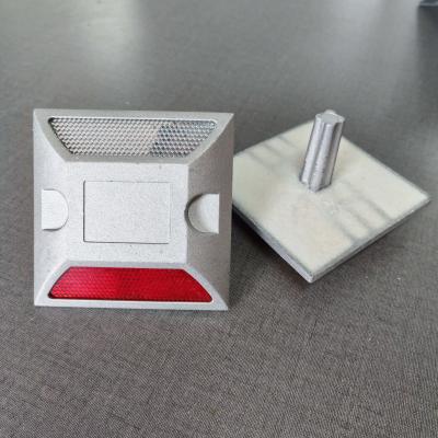 China Cat'S Eye  Reflective Sand Filled Aluminum Road Stud With Pin for sale