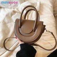 China Solid Color Cowhide Leather Saddle Bag Small Portable Crossbody Zipper Closure 20cm for sale