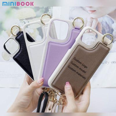 China Minibook Custom PU Leather Phone Case with Mirror Wrist Strap Card Holder for iPhone 14 16.5x8.3x3cm for sale