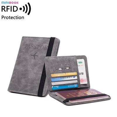 China Custom Logo PU Leather Passport Cover RFID Blocking Travel Wallet with Card Case 2 Slots for sale