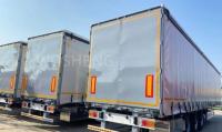 China 3 Axle 40ft 45ft PVC Tarpaulin Curtain Side Semi Trailer with Sliding Truck Design for sale