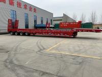 China Direct 4 Axles 16 Wheels Low Bed Semi Trailer with Max Payload of 30TON/60TON/80TON/100TON for sale