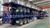 China Semi-Trailer 3 Axles 4 Axles Flat Deck Container Steel Truck Trailer Flat Bed Semi Trailer for sale