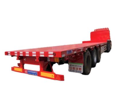 China Truck Trailer 3 Axles Flatbed Semi Trailer with 12.00R22.5 Tires and High Load Capacity for sale