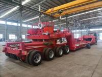 China Wosheng 4 Axles Low Bed Container Chassis Semi-Trailer for Heavy Duty Equipment Hauling for sale