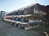 China 12 Wheels Low Bed Container Chassis Loader Semi Trailer with Q345B / T700 Steel Main Beam for sale
