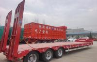 China Truck Steel Low Bed Container Chassis Loader Semi Trailer with 3 Axles and 12 Wheels for sale