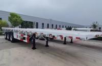 China 90T Max Payload Steel 20FT 40FT Container Flatbed Semi-Trailer with 12r22.5 Tyre for sale