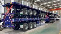 China 12R22.5 Tire Flatbed Semi Trailer for Africa Tare Weight 20T-80T Container Transport for sale