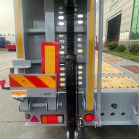 China 13000x3000x3300mm Customized 60Ton Heavy Duty Transport 3 Axles Low Bed Boy Semi-Trailer for sale