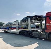 China Effortlessly Transport Cars with Wosheng 2 Axles Car Carrier Trailer and 4 pcs Rims for sale