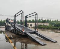 China Effortlessly Transport Cars with Wosheng 2 Axles Car Carrier Trailer and 4 pcs Rims for sale