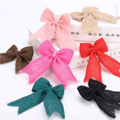 China 8cm x 11cm Jute Ribbon Bow with Green Rose Decorative Element for Gift Wrapping and Craft Projects for sale